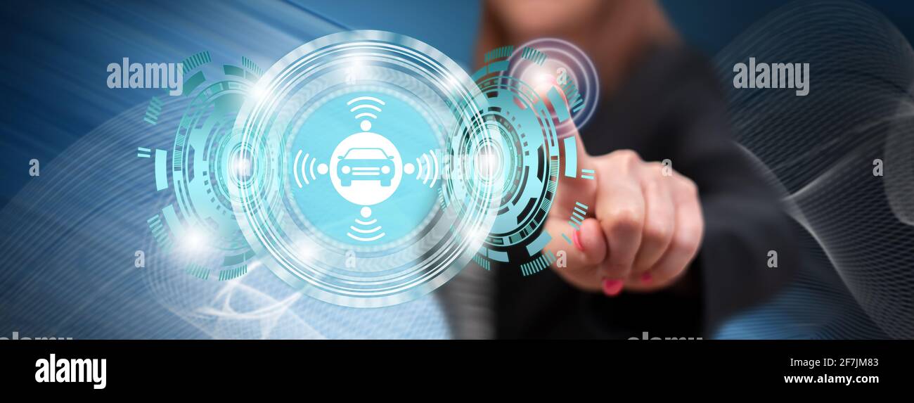 Woman touching a smart car concept on a touch screen with her finger ...