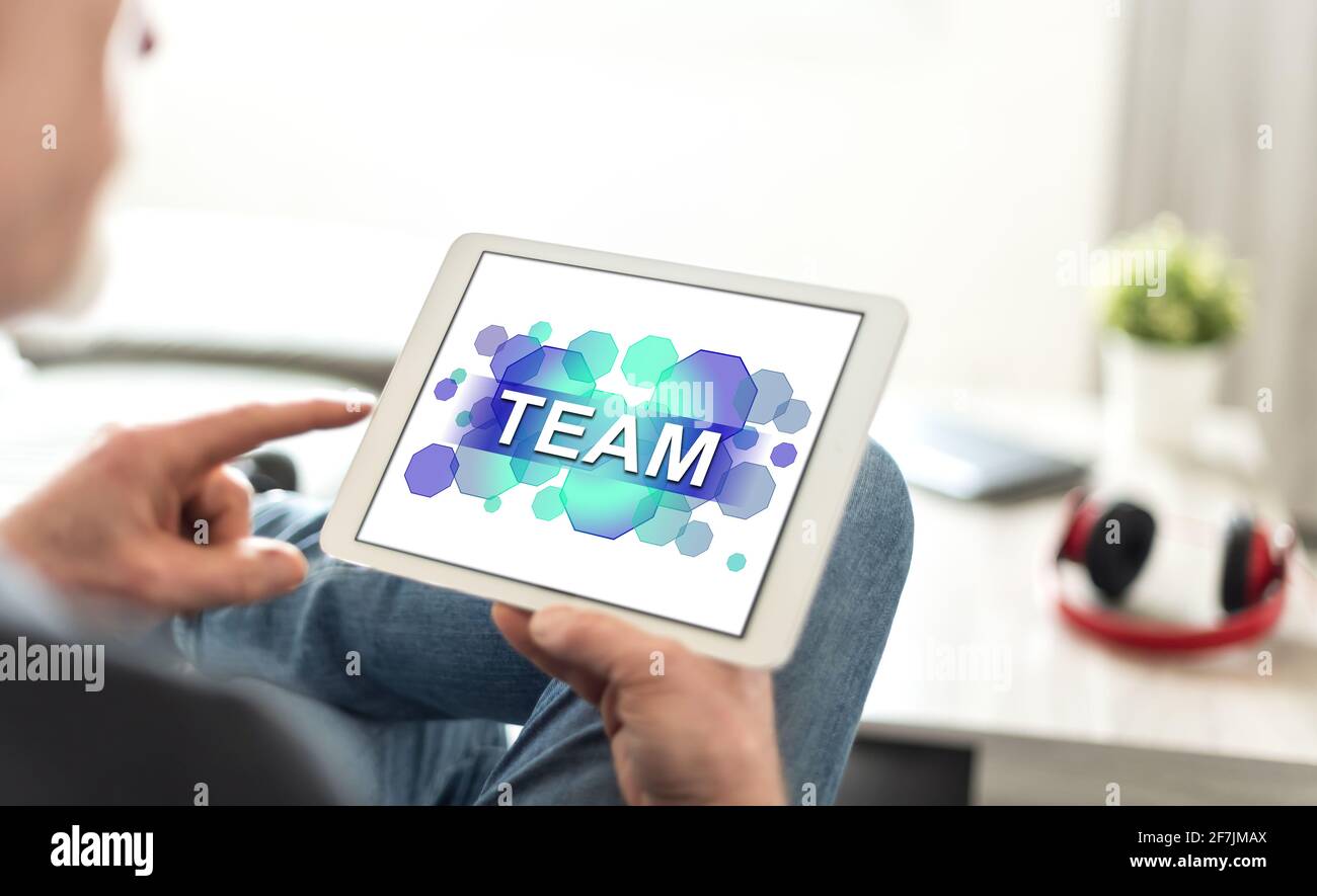 Tablet screen displaying a team concept Stock Photo - Alamy