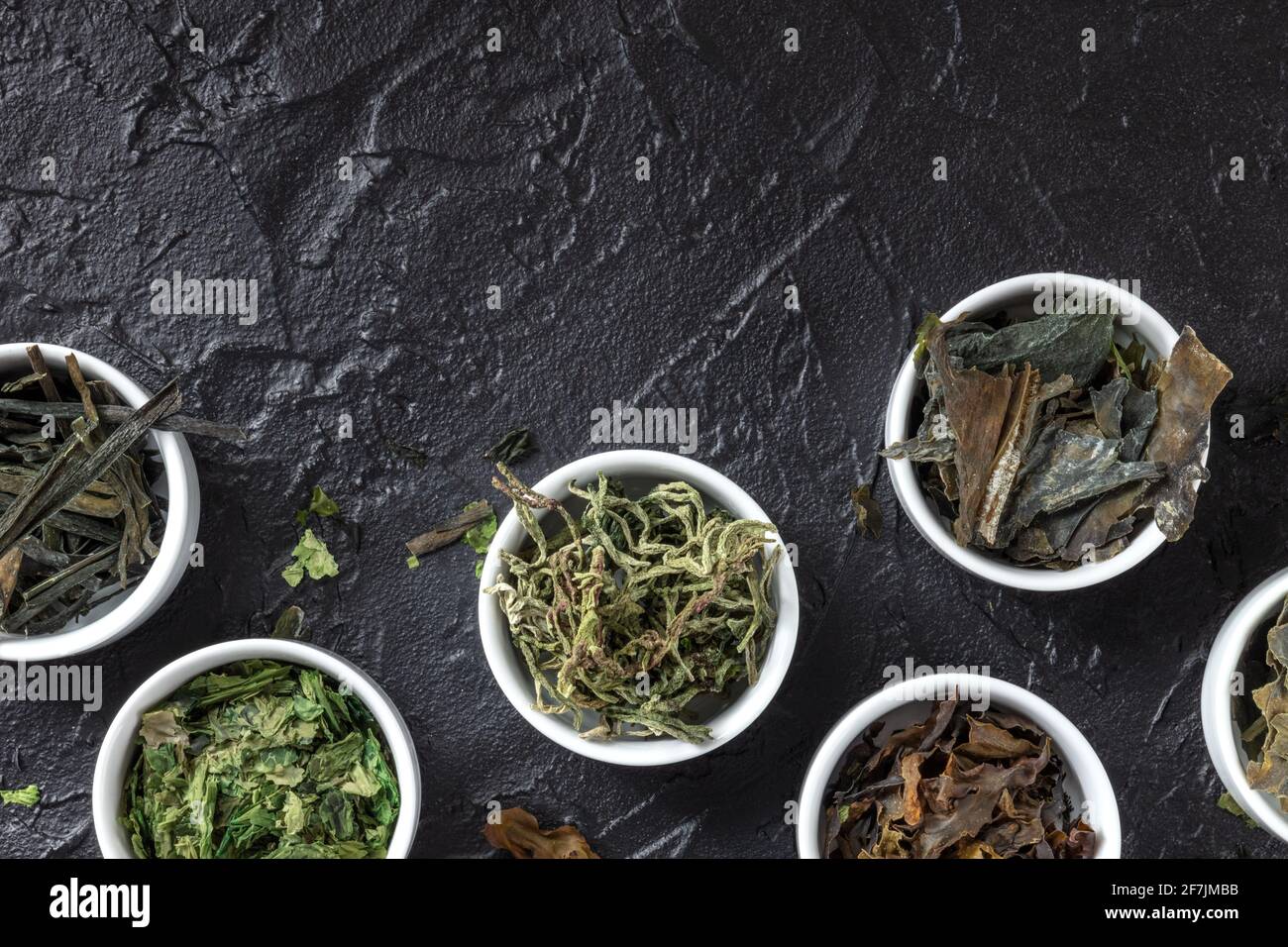 Various edible algae, sea vegetables, shot from above on a black ...