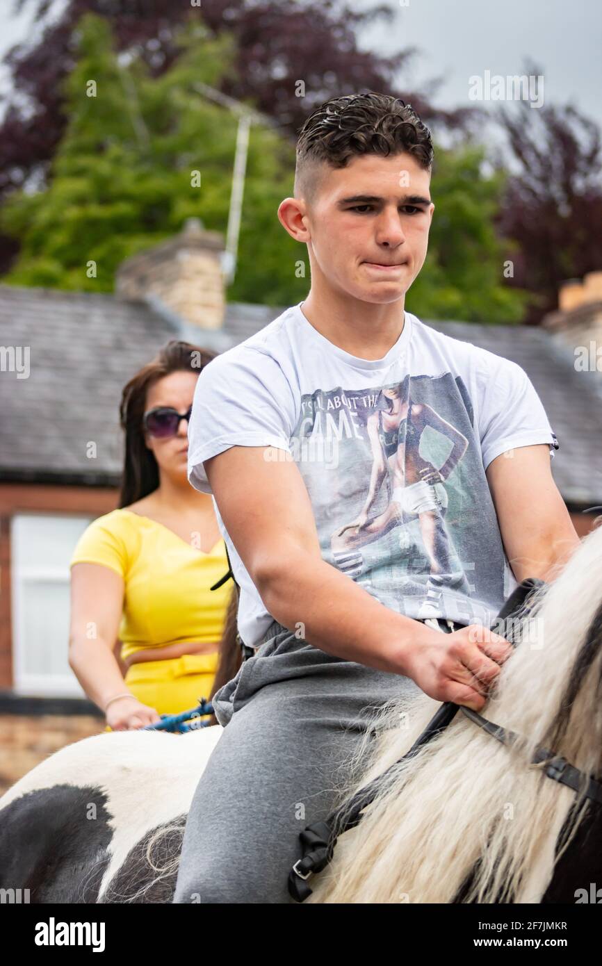 young gypsy traveller man on horse in river at Appleby Horse fair ...