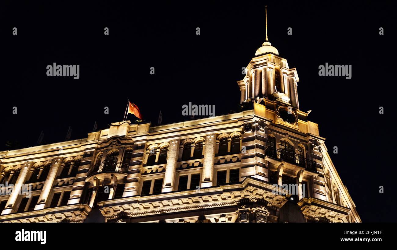 Building with lights on at night in Shanghai City Stock Photo - Alamy