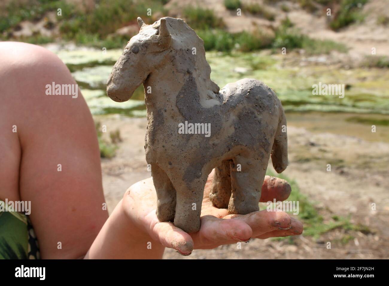 The horse is molded from fresh lake clay Stock Photo - Alamy