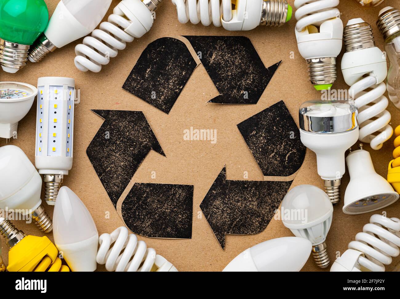 Recycling symbol surrounded by used light bulbs on craft paper Stock ...