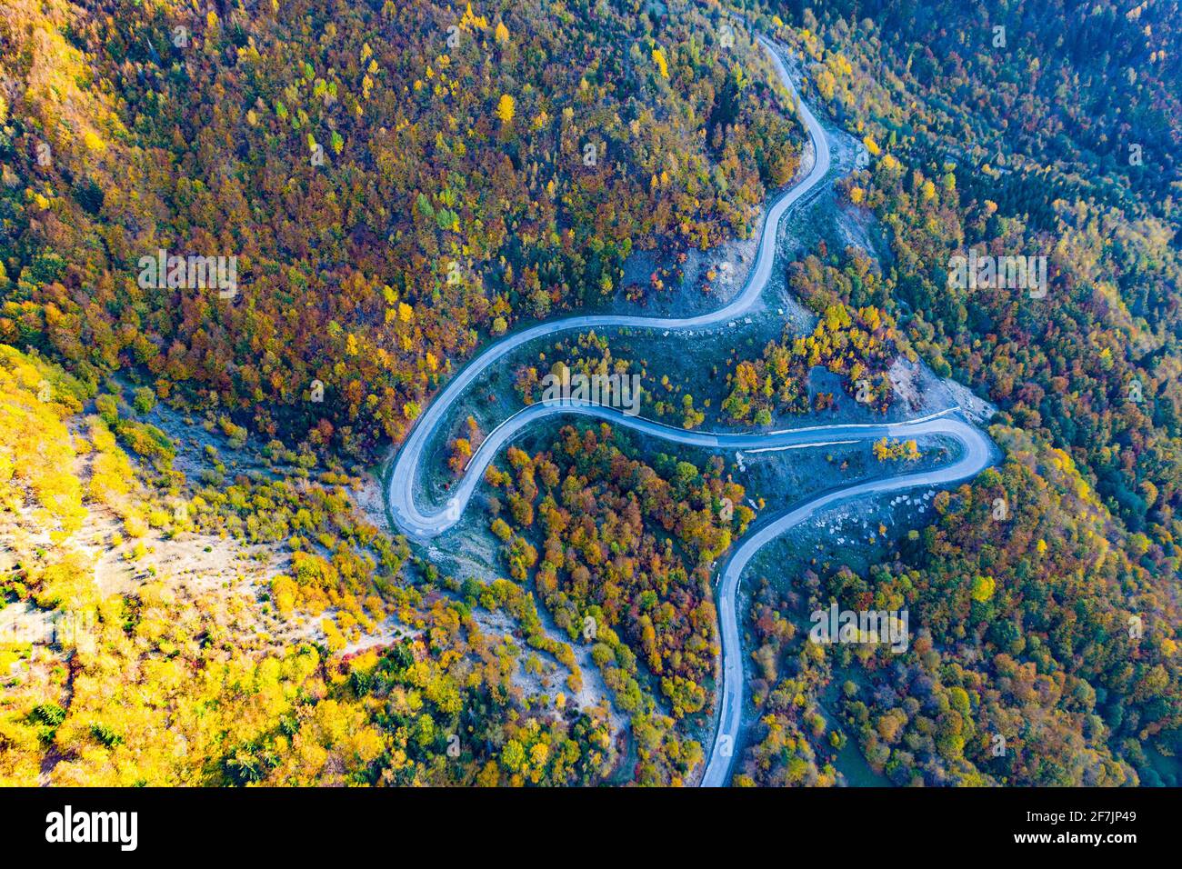 Winding road in the mountains, autumn forest view from a drone Stock ...