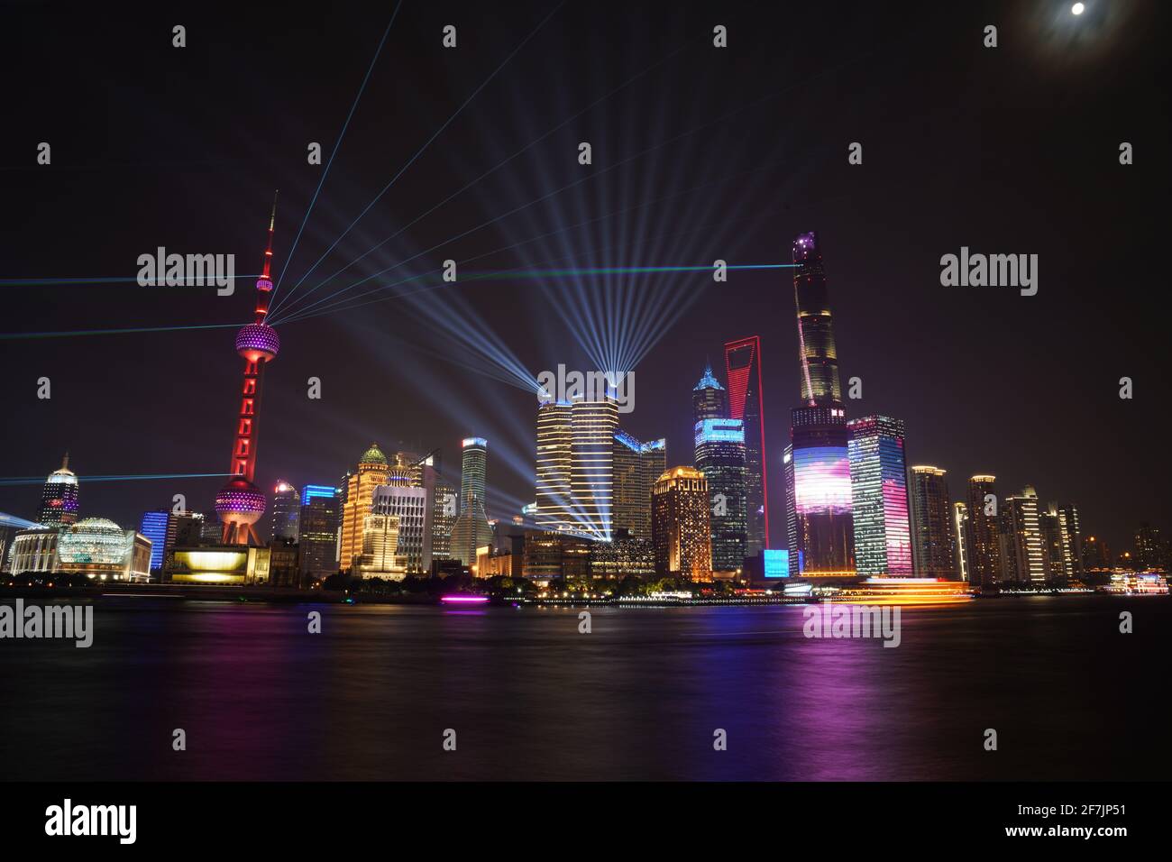 Tall buildings and towers with colourful LED lights on during night in ...