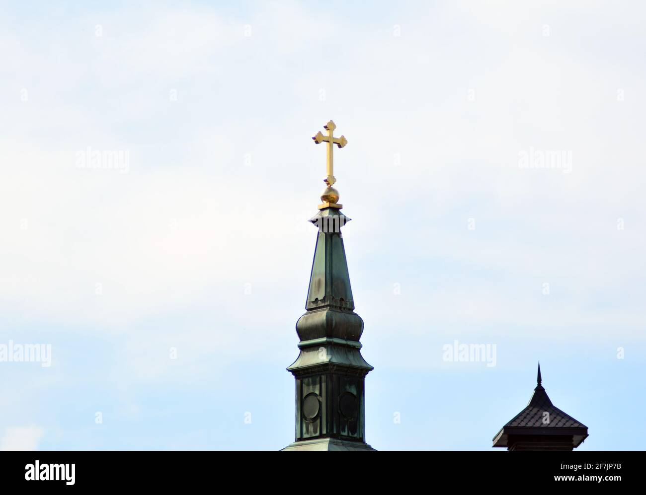 a golden church cross on a top of a cube Stock Photo - Alamy