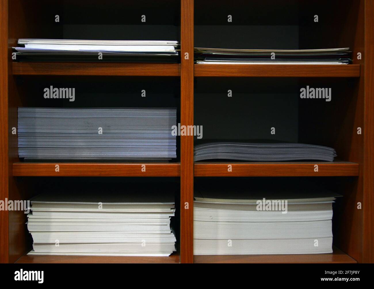 brown shelf with sheets of papers Stock Photo - Alamy