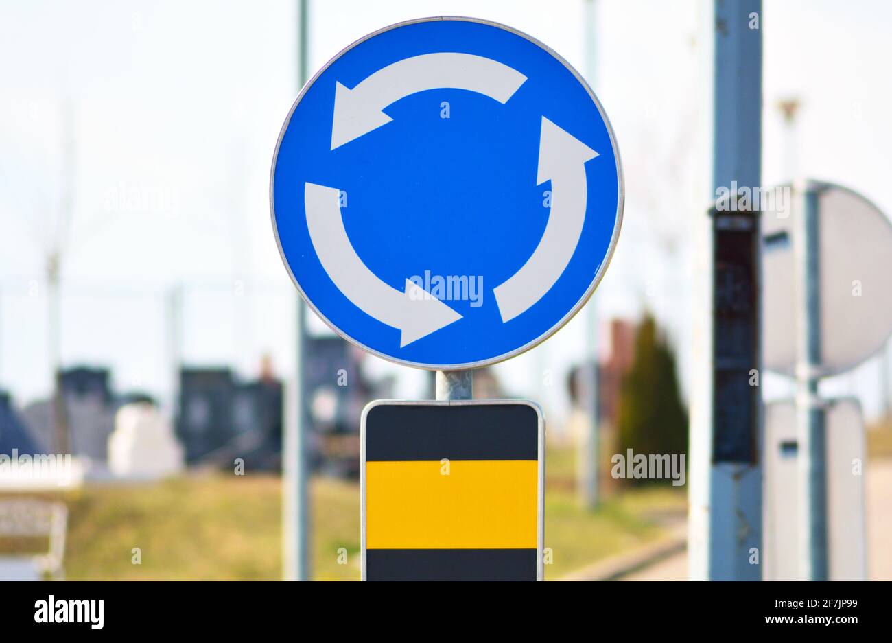 a blue roundabout traffic sign on a post Stock Photo - Alamy