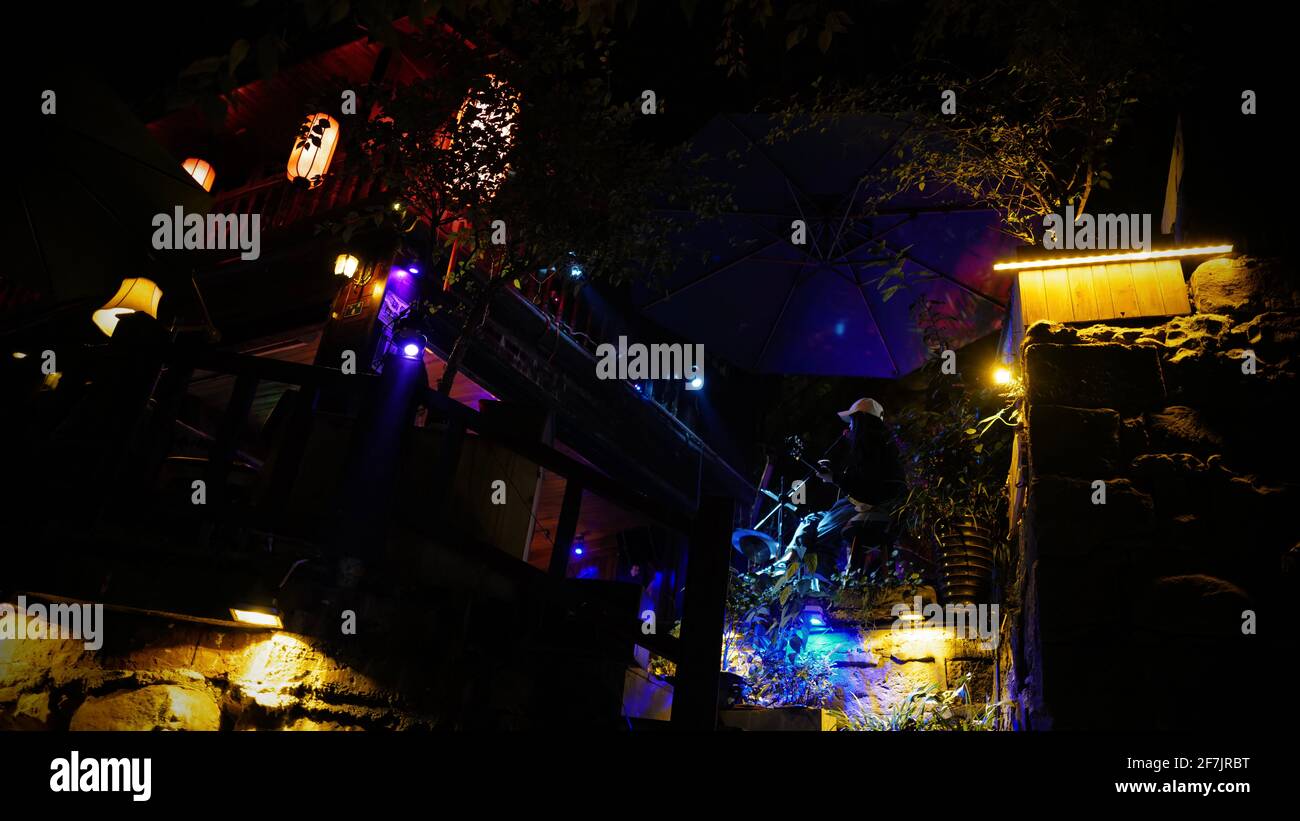 Singing bar with colourful LED lights on during nigh time Stock Photo ...