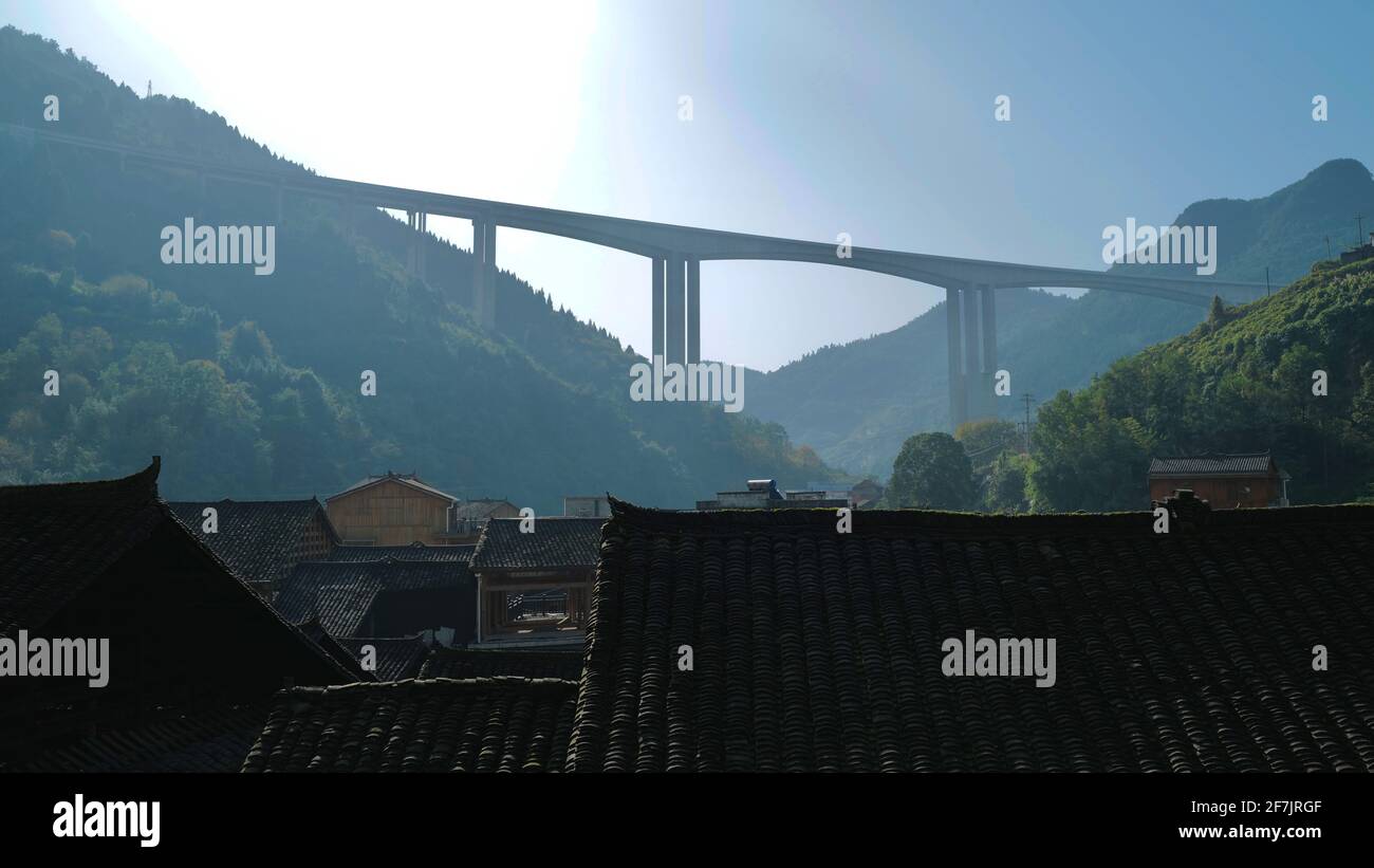 Viaduct over Hmong Village of Pheonix Town in Hunan Stock Photo - Alamy