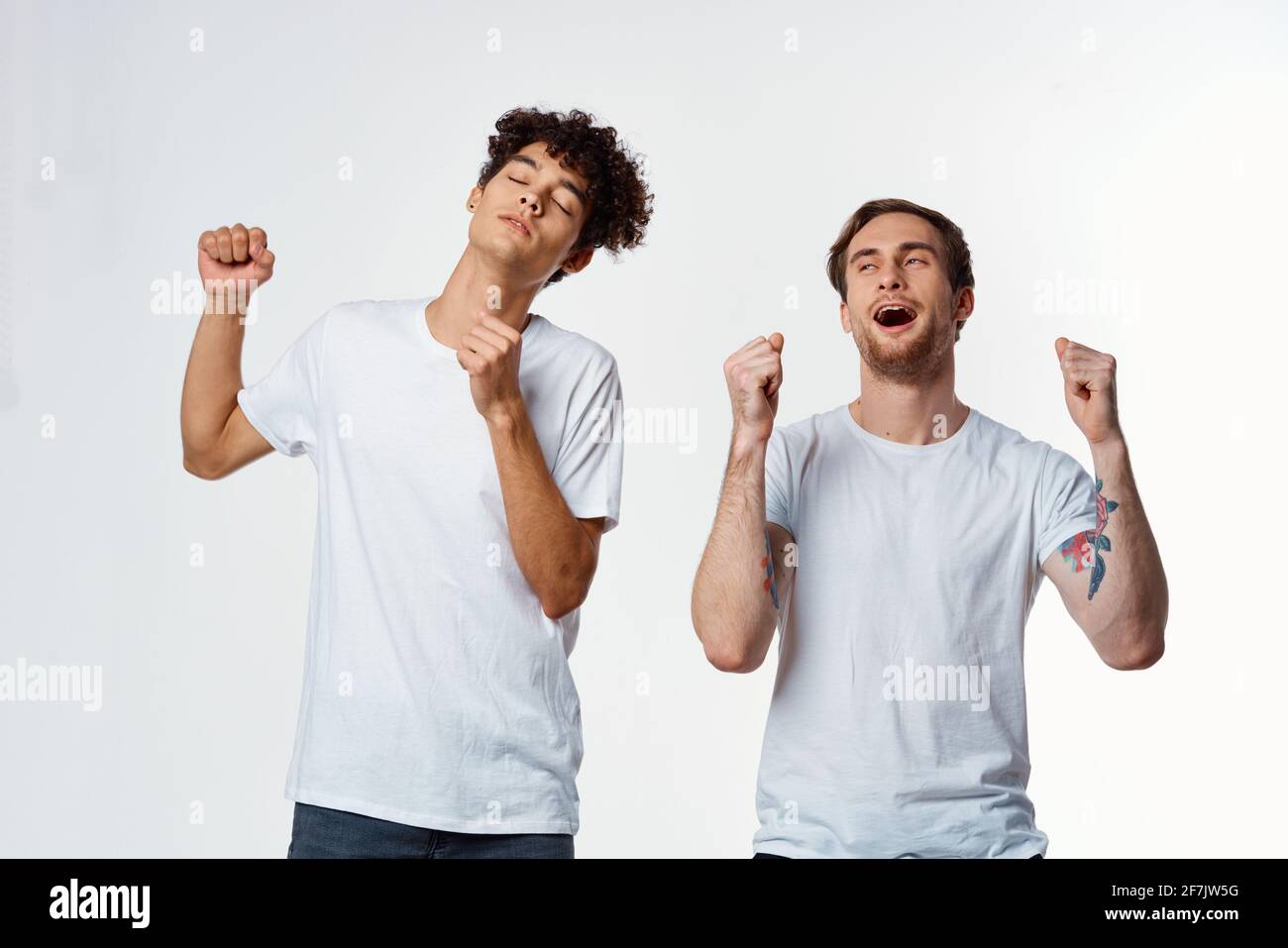 two joyful men friendship emotions communication studio Stock Photo - Alamy