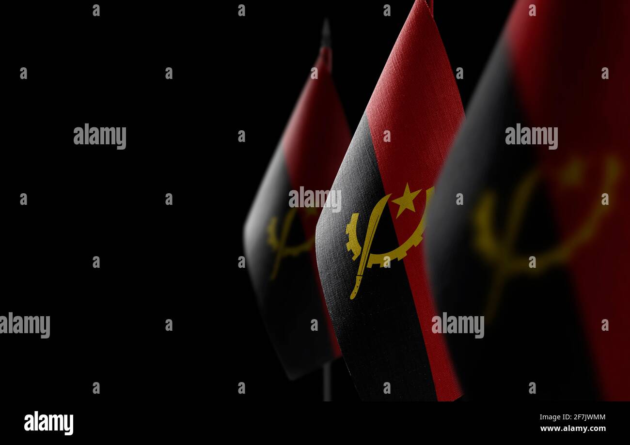 Small national flags of the Angola on a black background Stock Photo ...