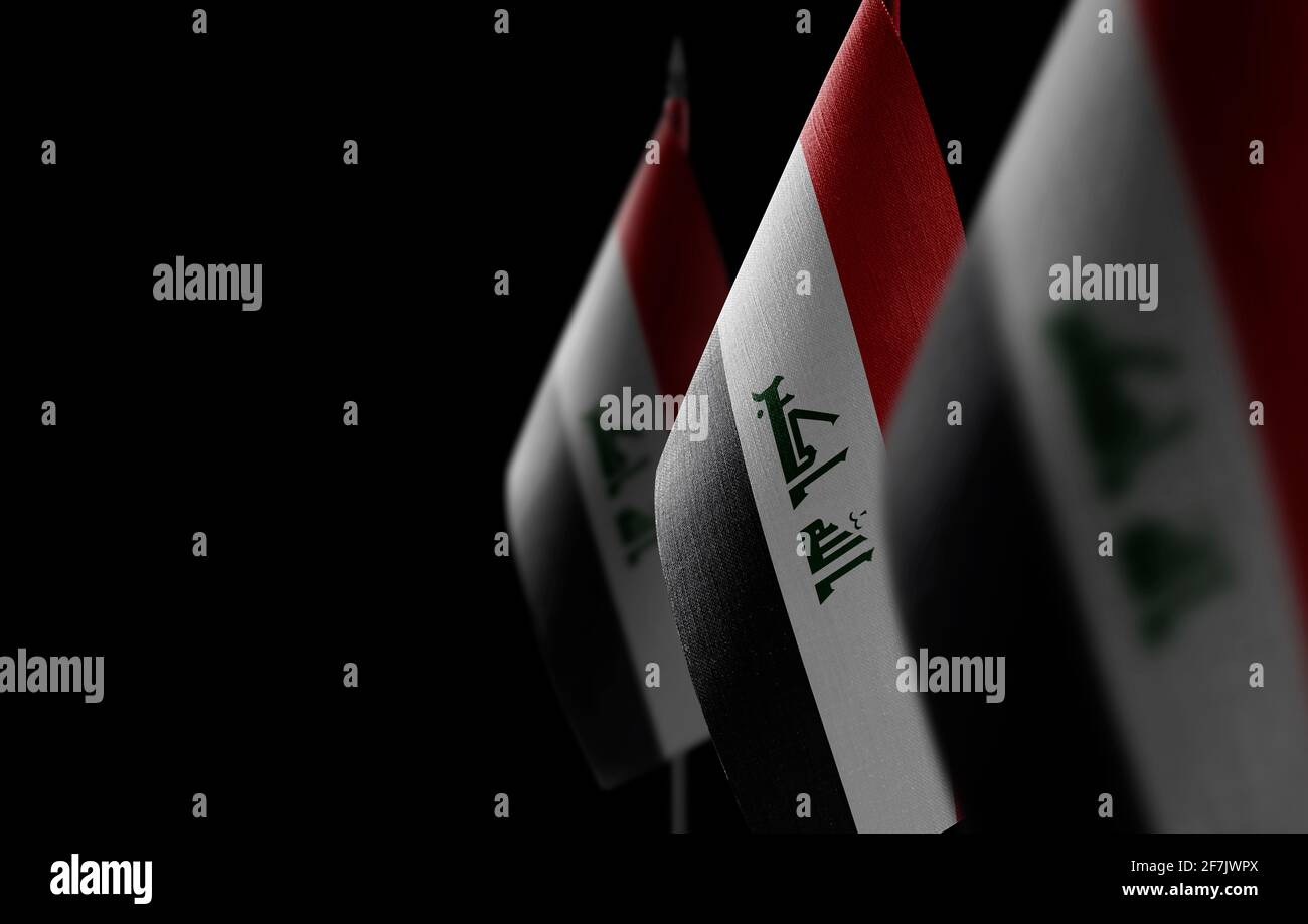 Small national flags of the Iraq on a black background Stock Photo - Alamy
