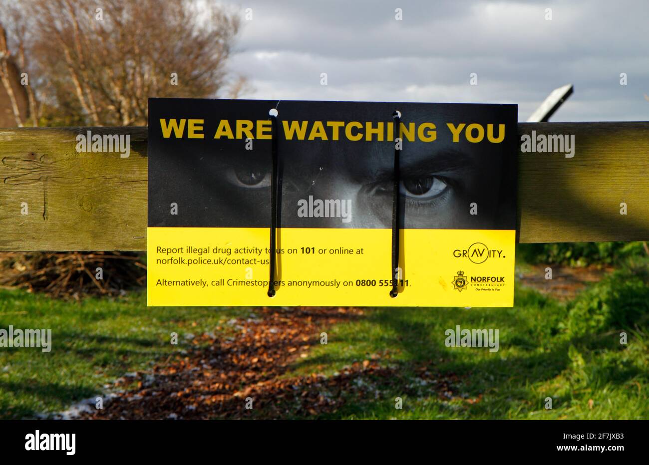 A sign warning against illegal drug activity positioned in a small ...