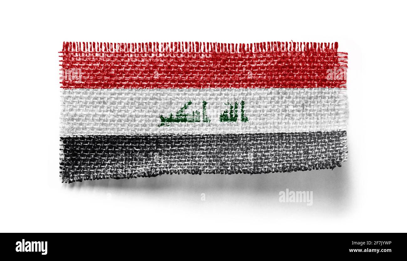 Iraq flag on a piece of cloth on a white background Stock Photo - Alamy