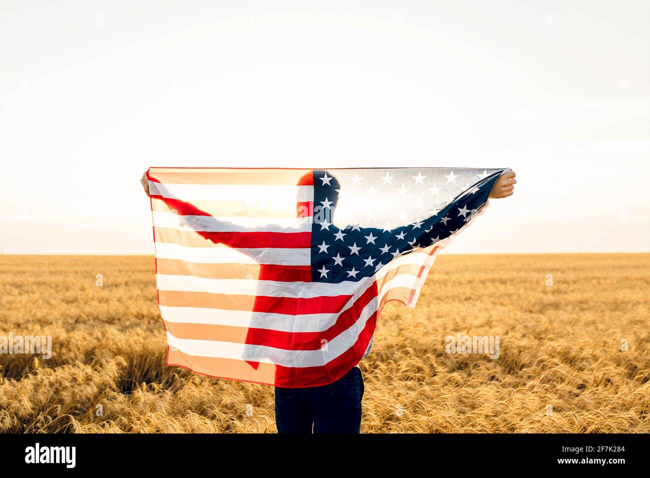 Back view of man with american flag hi-res stock photography and images ...