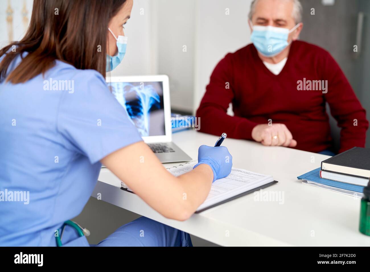 Compiling a thorough plan towards her patient's healing Stock Photo - Alamy