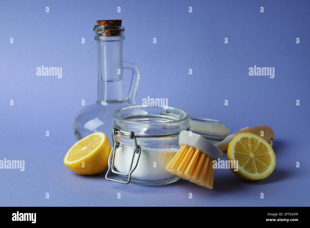Cleaning concept with cleaning tools on violet background Stock Photo ...
