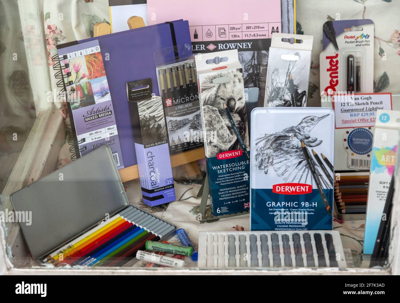 Display of various art materials for drawing sketching in shop window ...