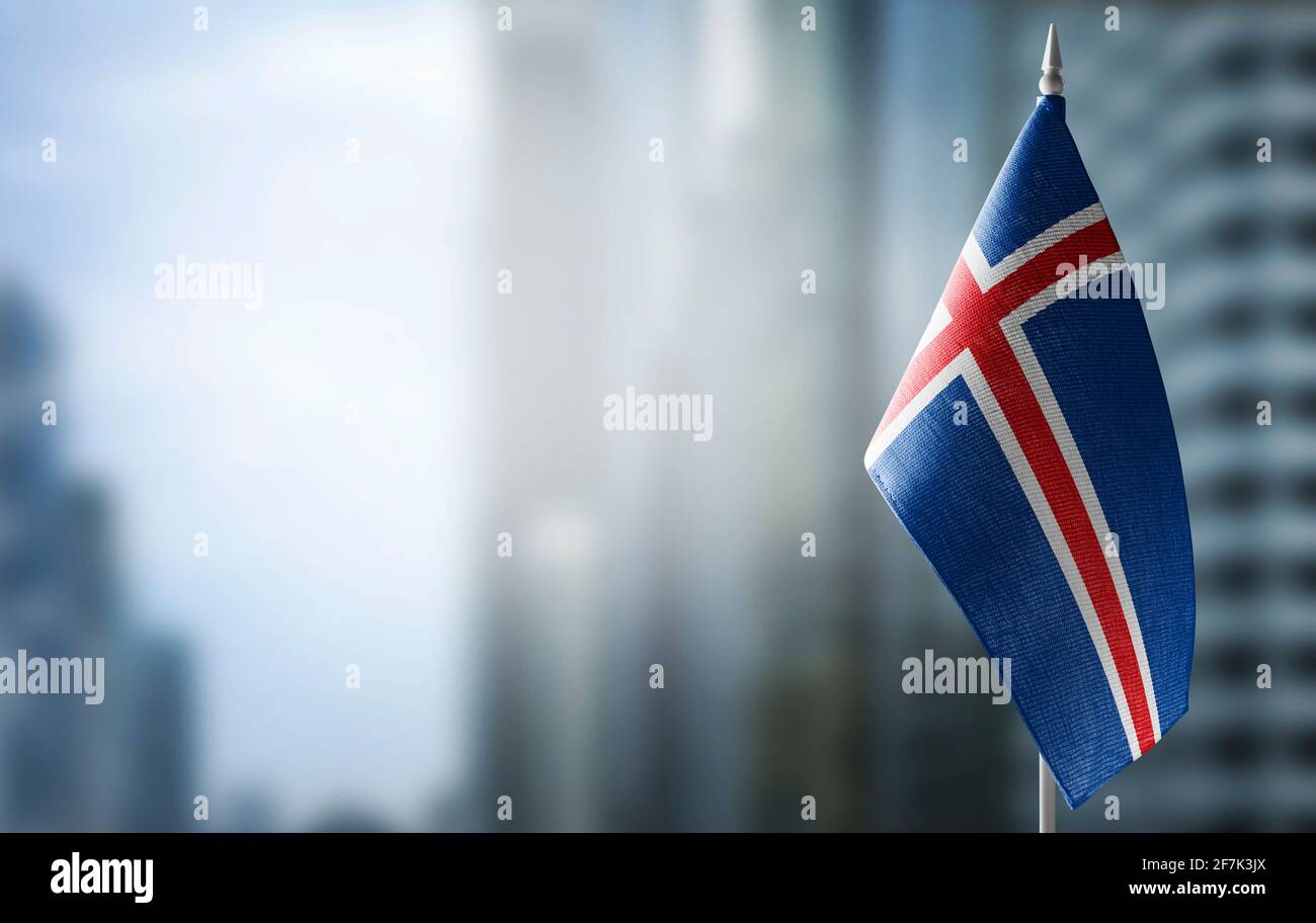 A small flag of Iceland on the background of a blurred background Stock ...