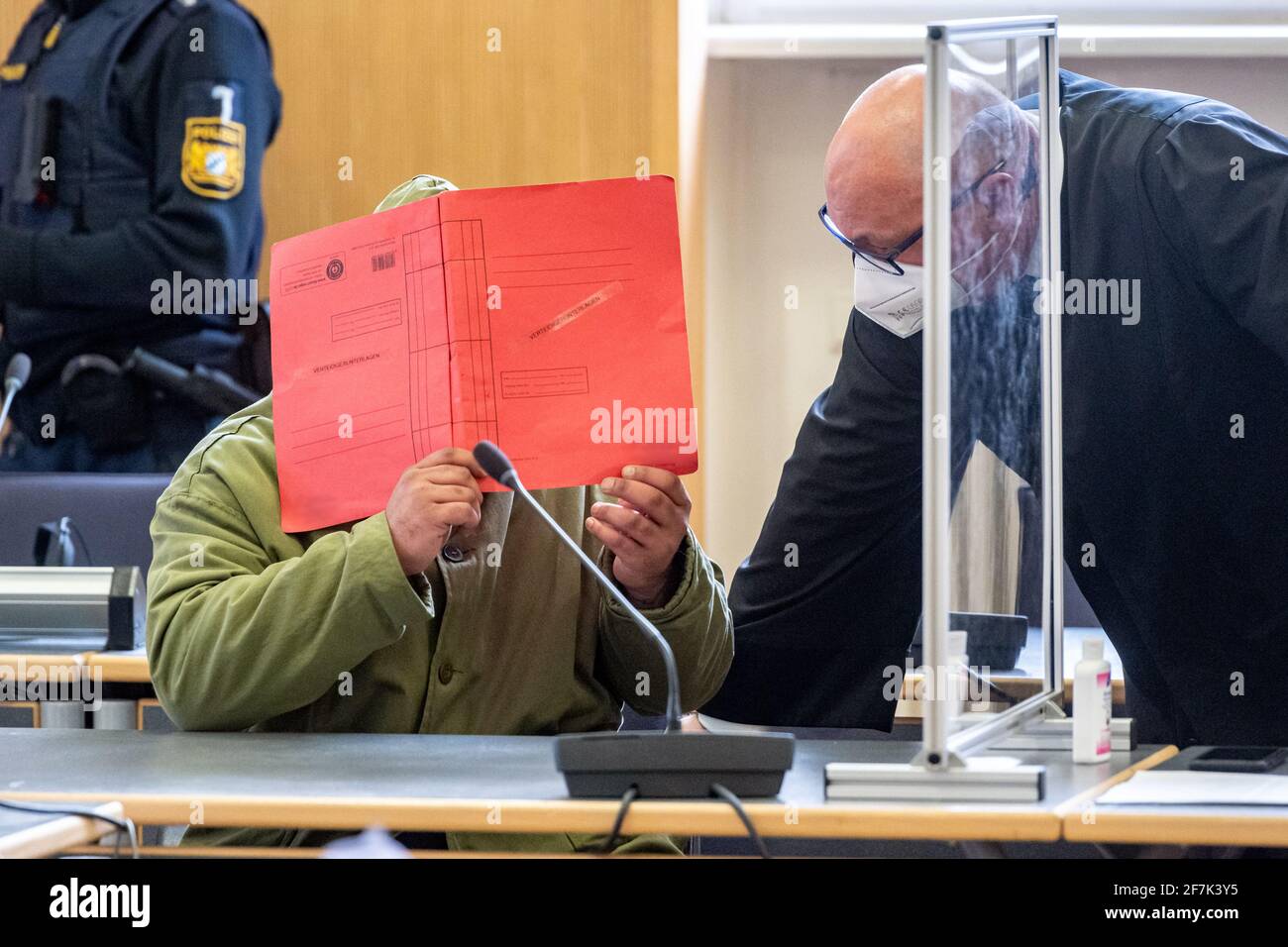 Regensburg, Germany. 08th Apr, 2021. The defendant (l) speaks with his ...