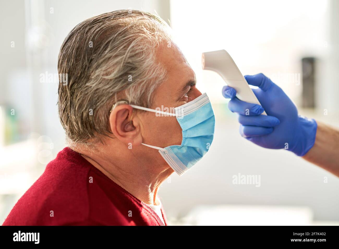 Side view of senior patient while taking the temperature Stock Photo ...