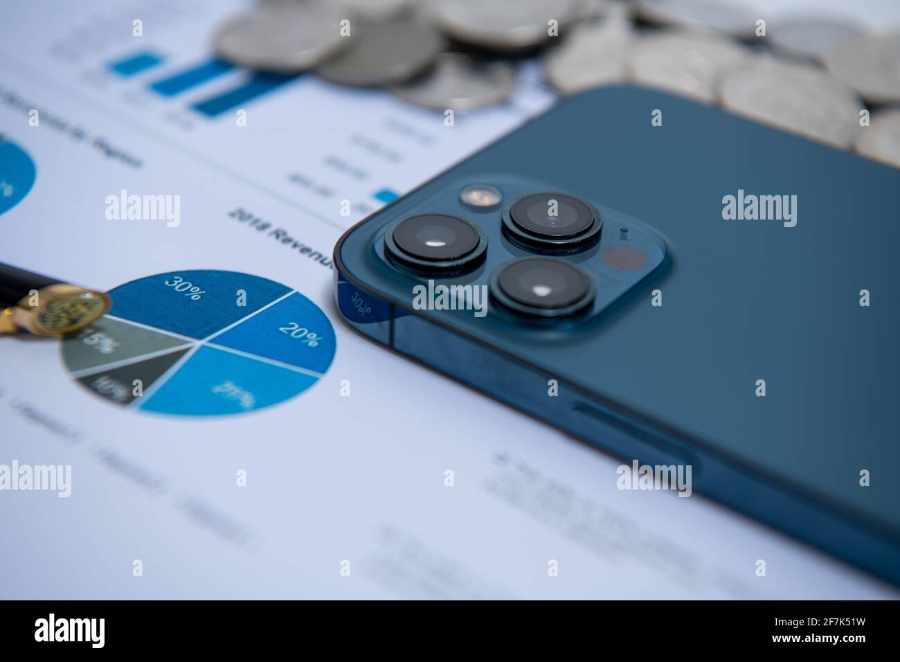 Financial Statement of the year with I phone 12 Pro Max selective focus ...