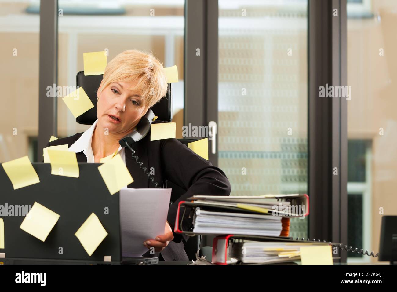 woman having stress in the office - multitasking and time management ...