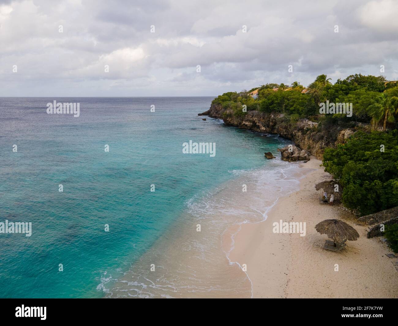 Beach and Pier at playa Kalki in Curacao, tropical beach from the sky ...