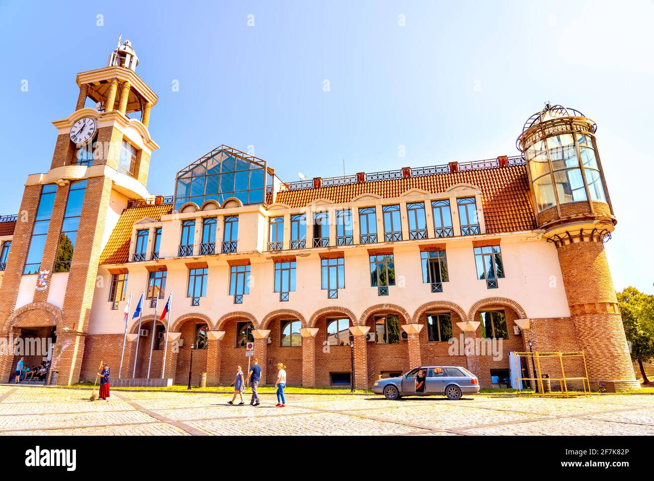 Hotel building with clock, building facade Stock Photo - Alamy