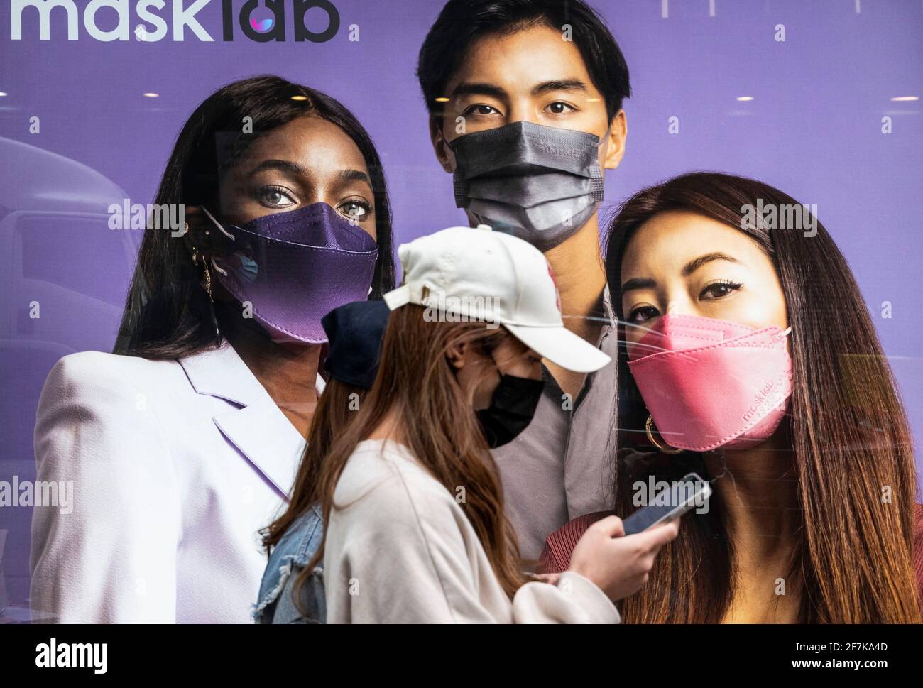 A pedestrian wearing a facemask as a preventive measure against the ...