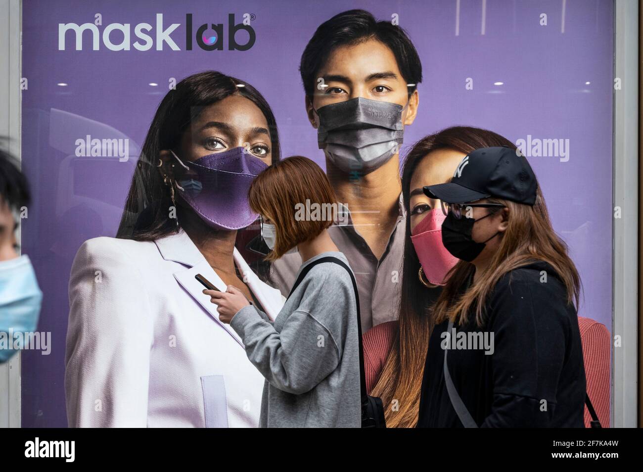 Pedestrians wearing facemasks as a preventive measure against the ...