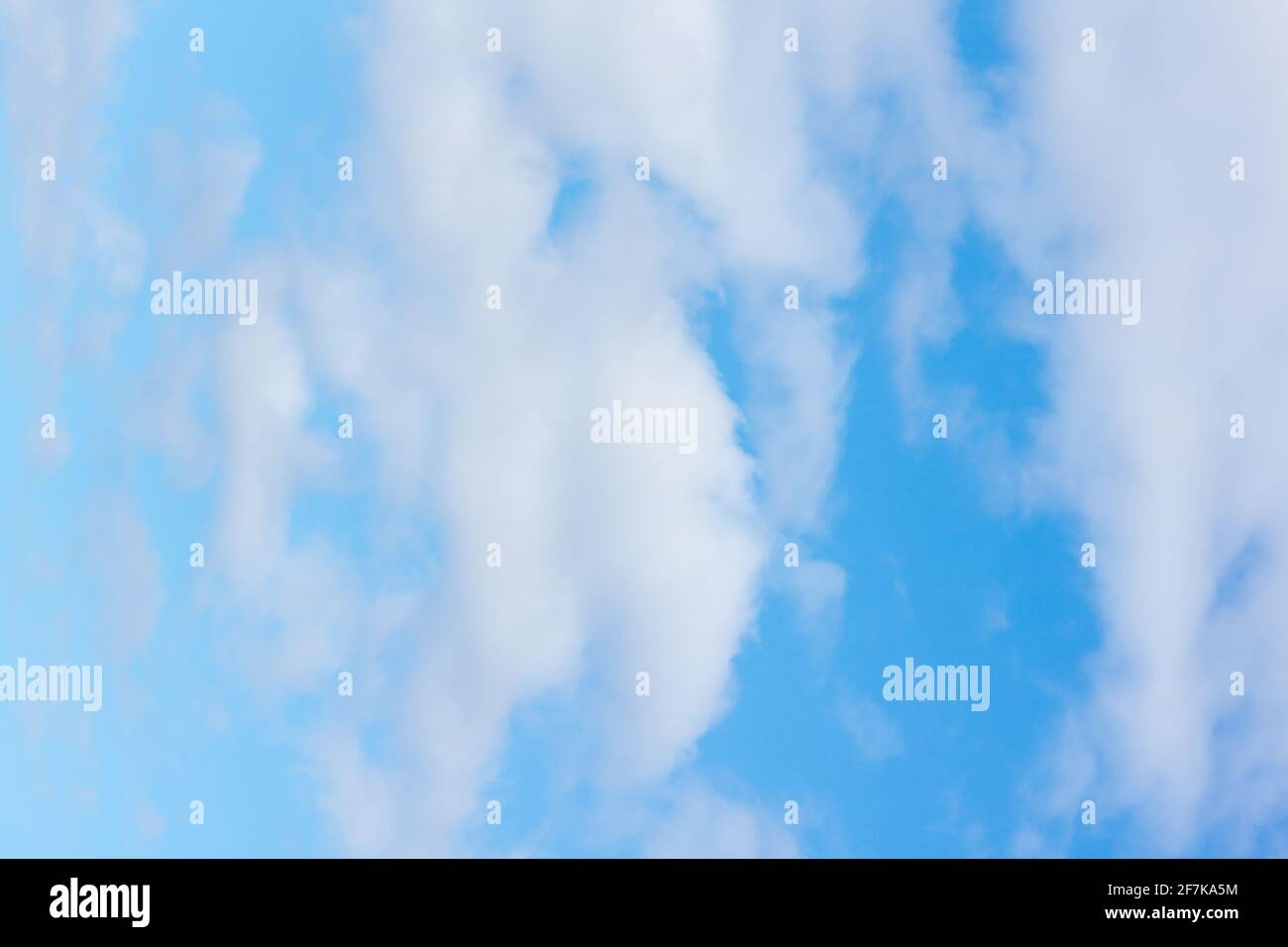 blue sky with flying white light clouds Stock Photo - Alamy