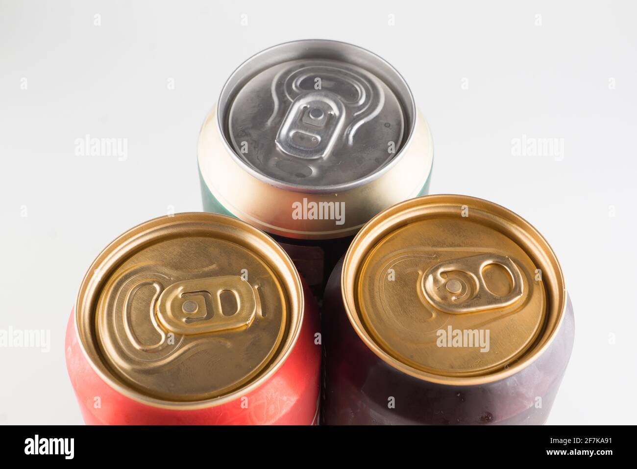 three metal cold cans with beer on a white background Stock Photo - Alamy