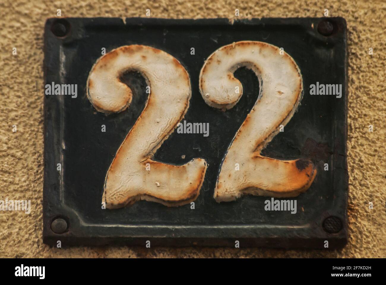 Old retro weathered cast iron plate with number 22 closeup Stock Photo ...