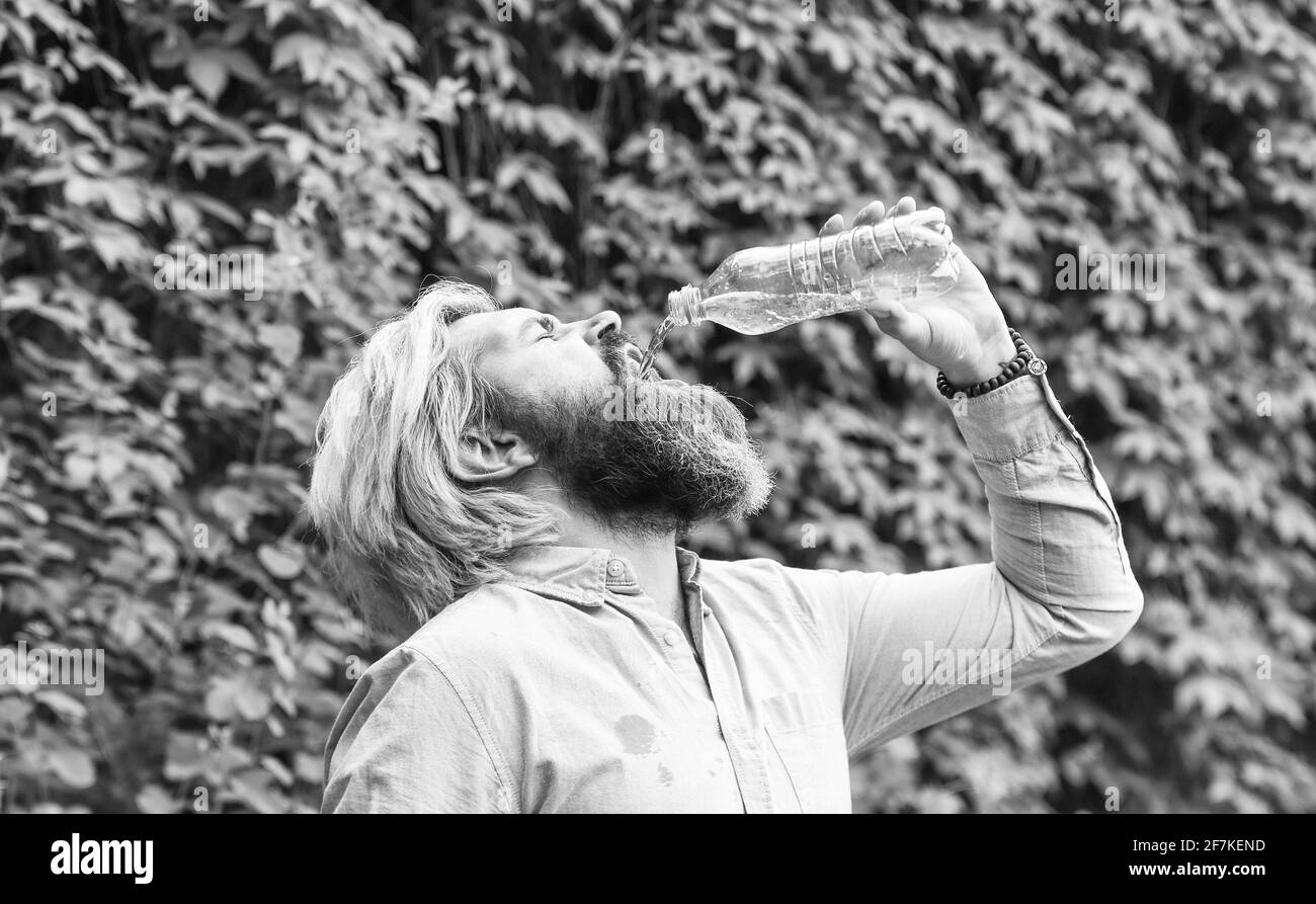 drain the bottle. Daily intake of water. Thirsty male model enjoying ... drain the bottle. Daily intake of water. Thirsty male model enjoying ...