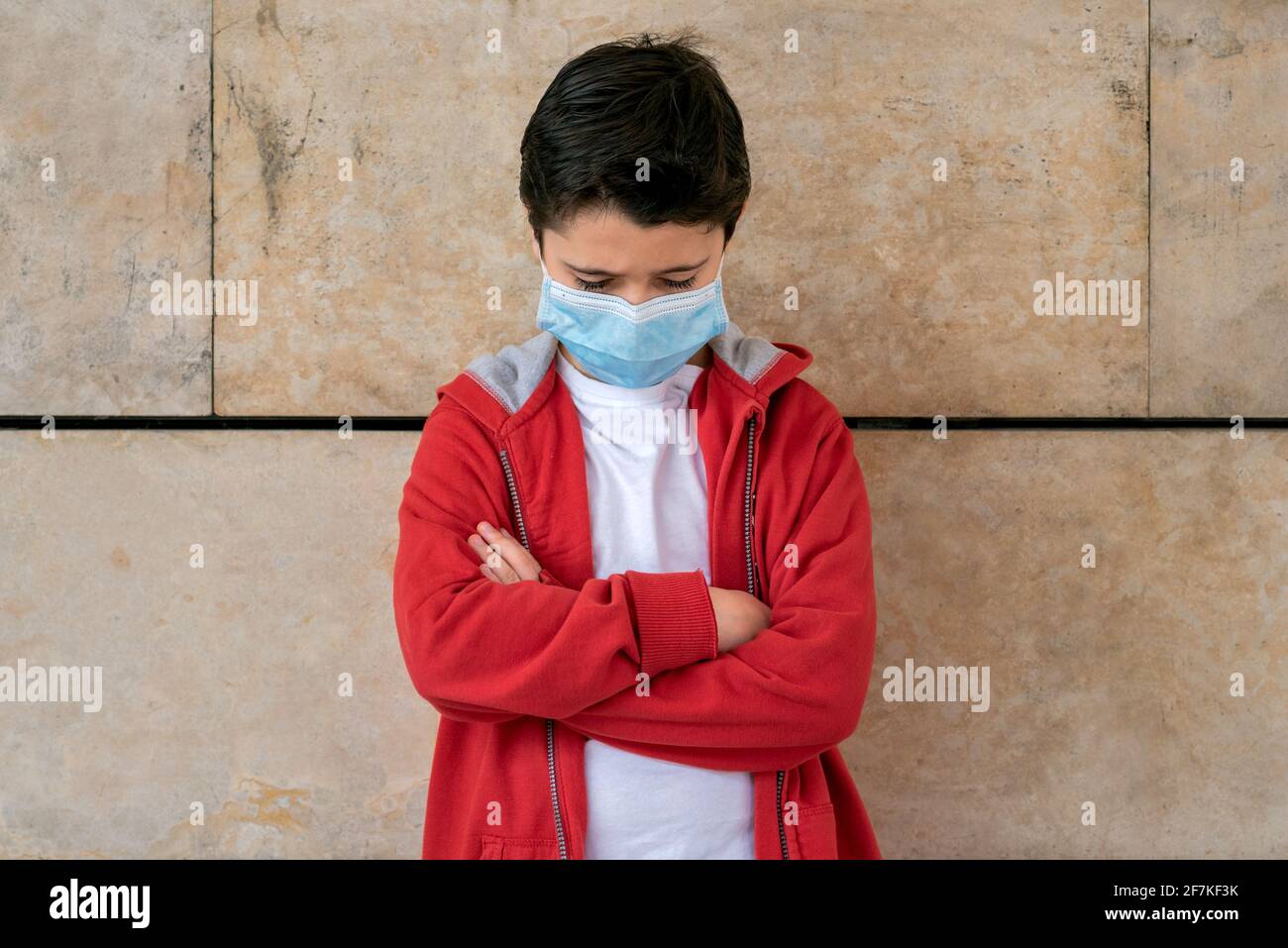 sad and angry kid with protective surgical mask outdoor Stock Photo - Alamy