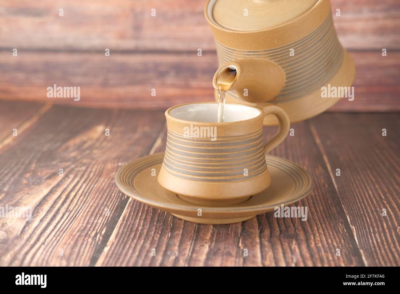 pouring tea from a tea ceremony top down Stock Photo - Alamy