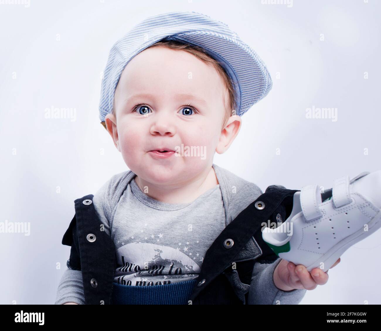 studio portrait of a cheeky little toddler Stock Photo - Alamy
