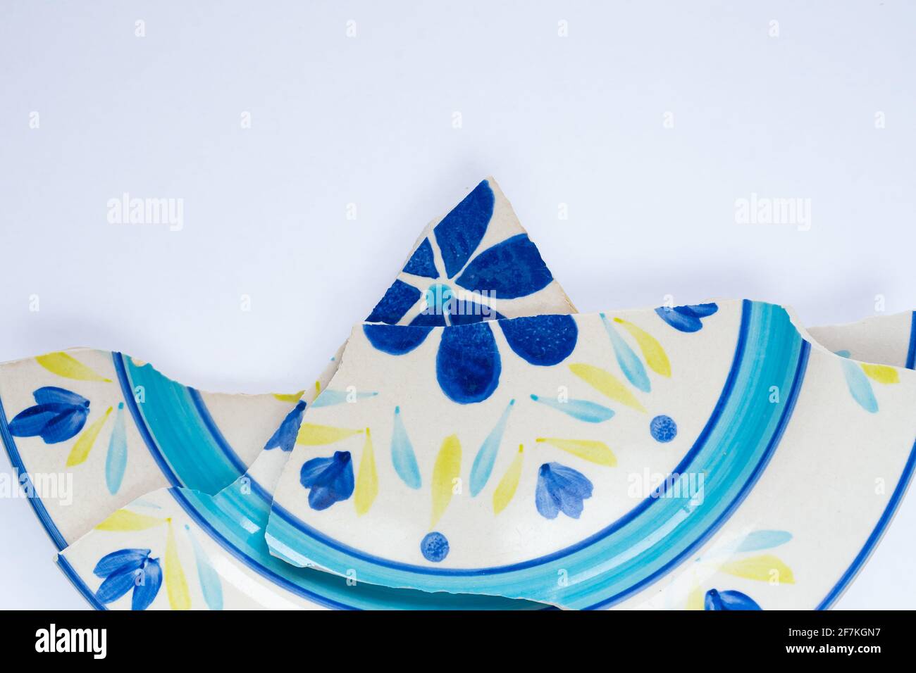 Broken ceramic plate on white background. Made in natural light Stock ...