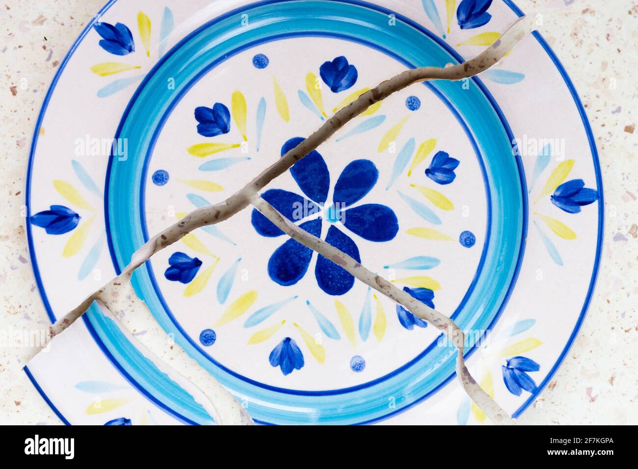 Broken ceramic plate on the table . Made in natural light Stock Photo ...