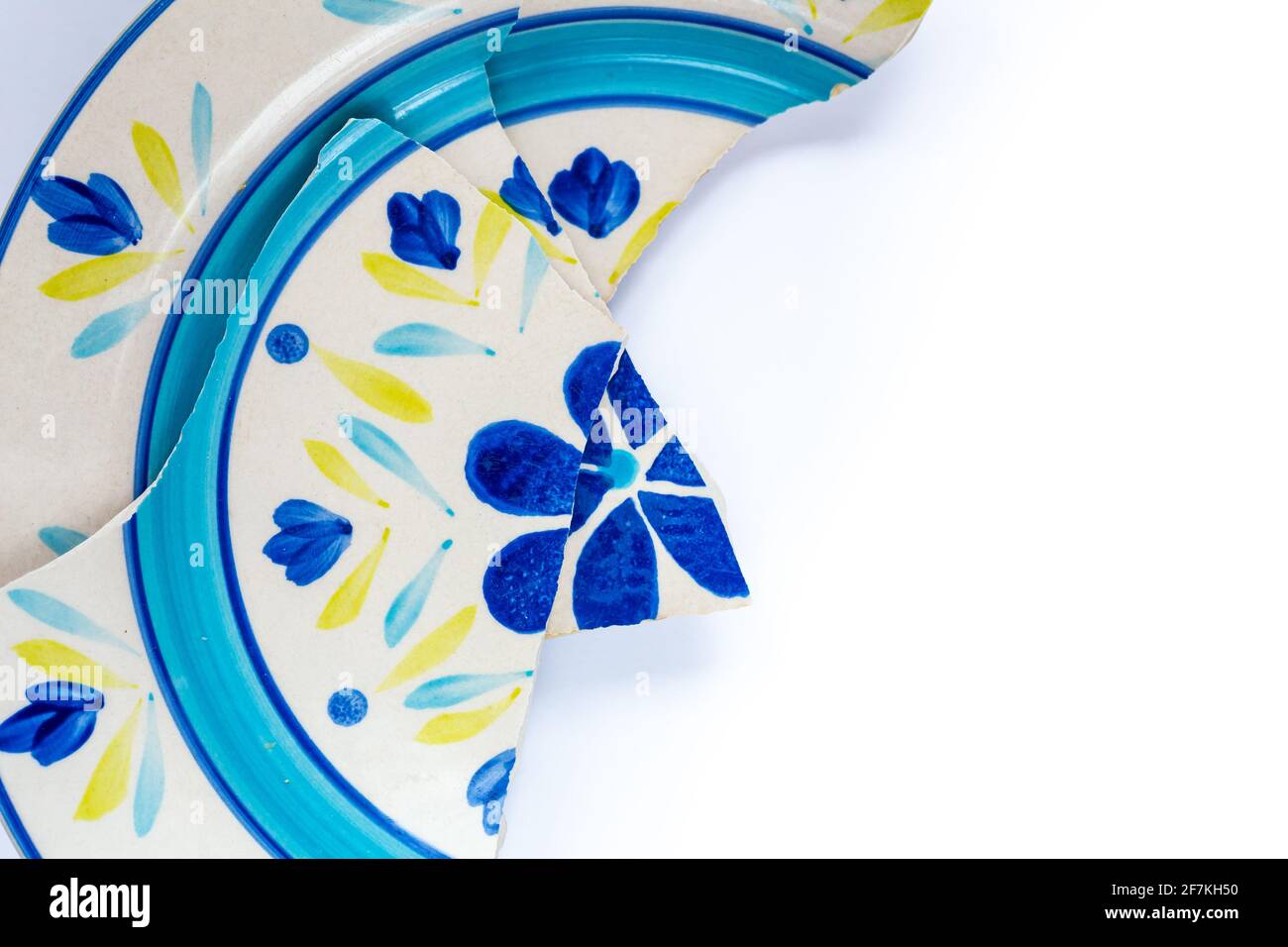 Broken ceramic plate on white background. Made in natural light Stock ...