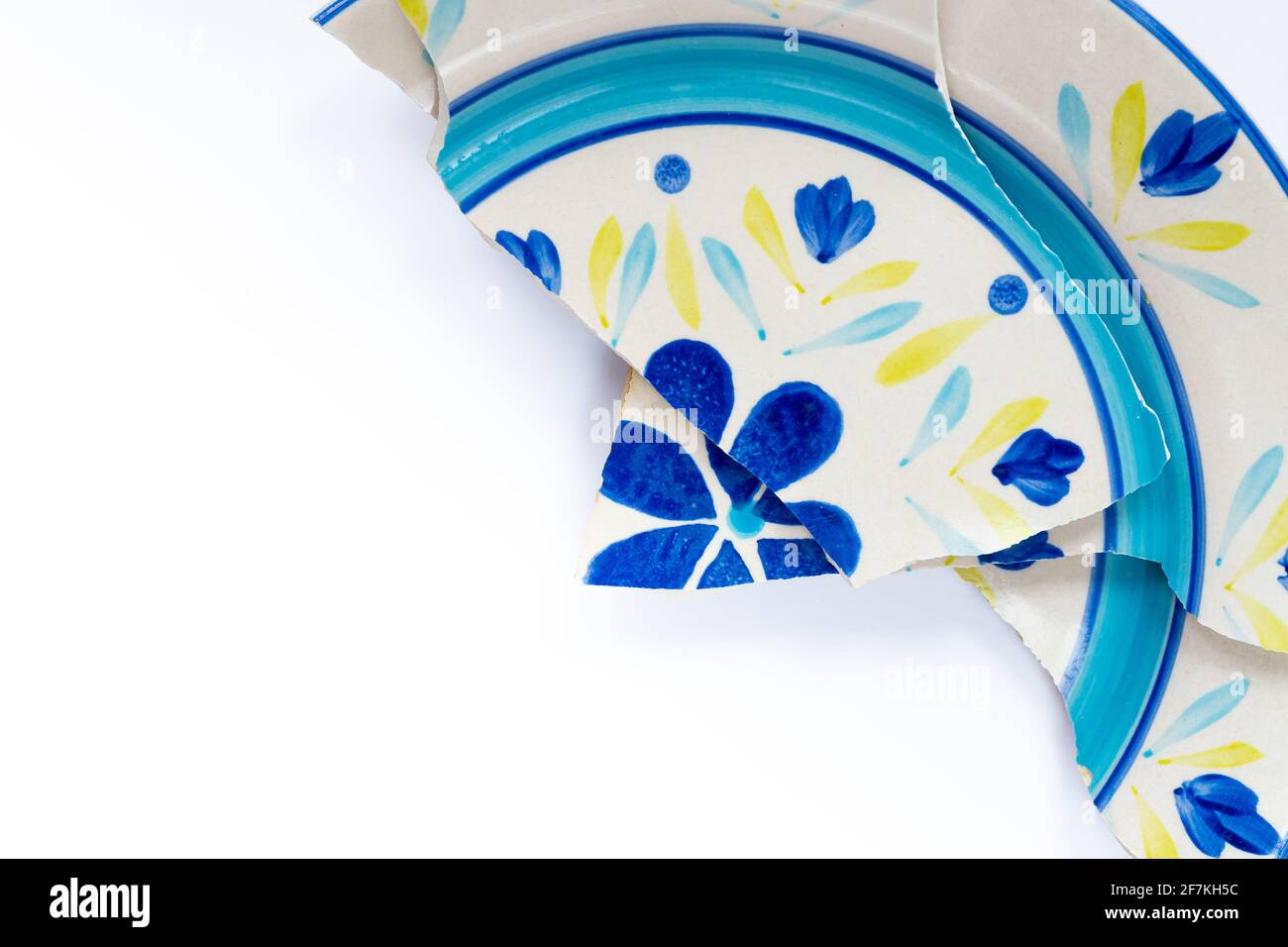 Broken ceramic plate on white background. Made in natural light Stock ...
