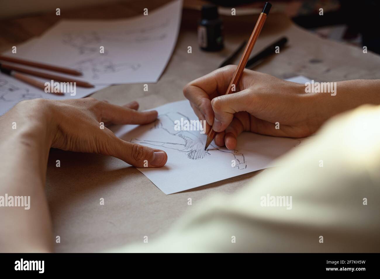 Artist drawing figure pencil sketches. Artwork background Stock Photo ...