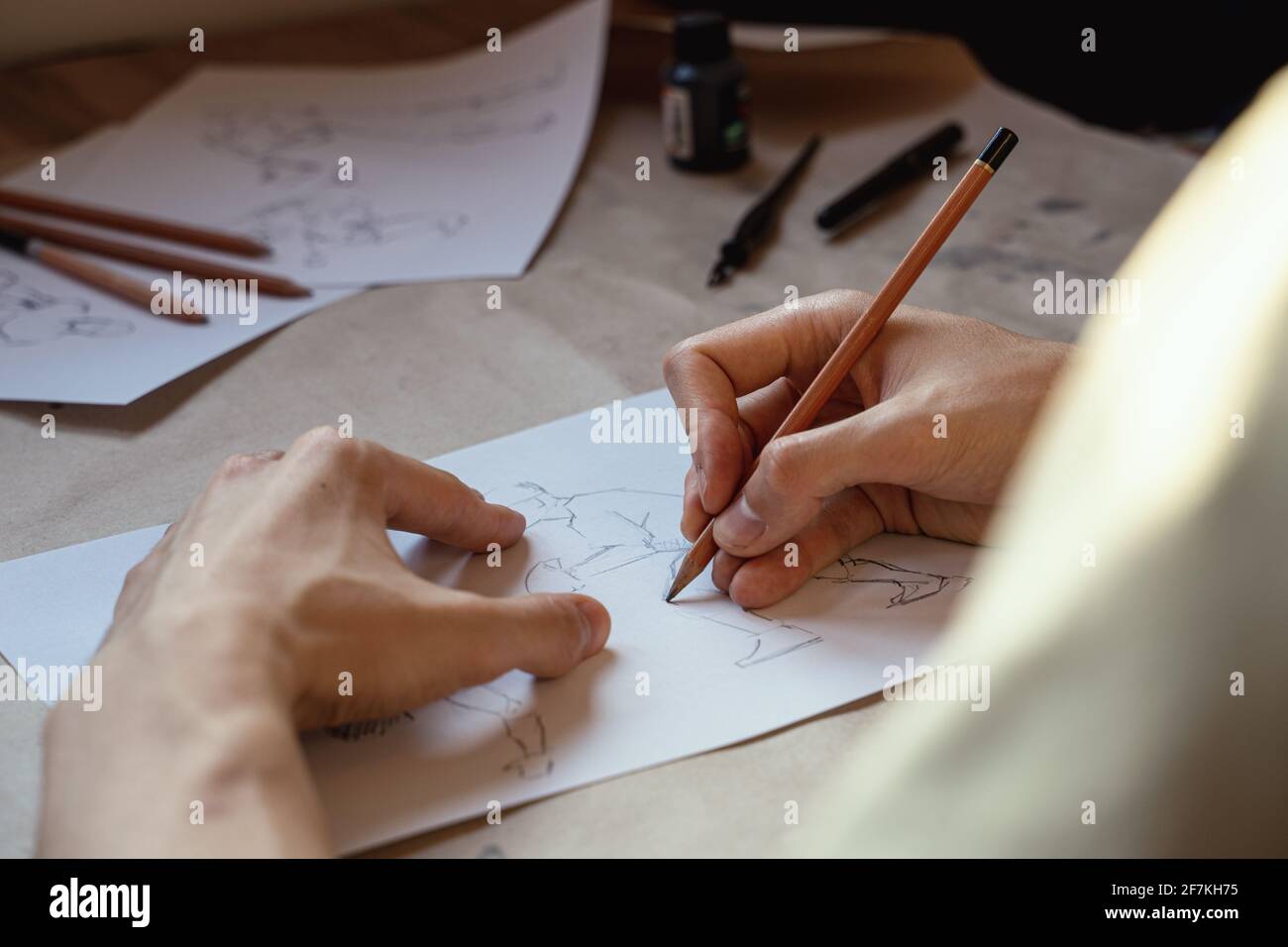 Artist drawing figure pencil sketches. Artwork background Stock Photo ...