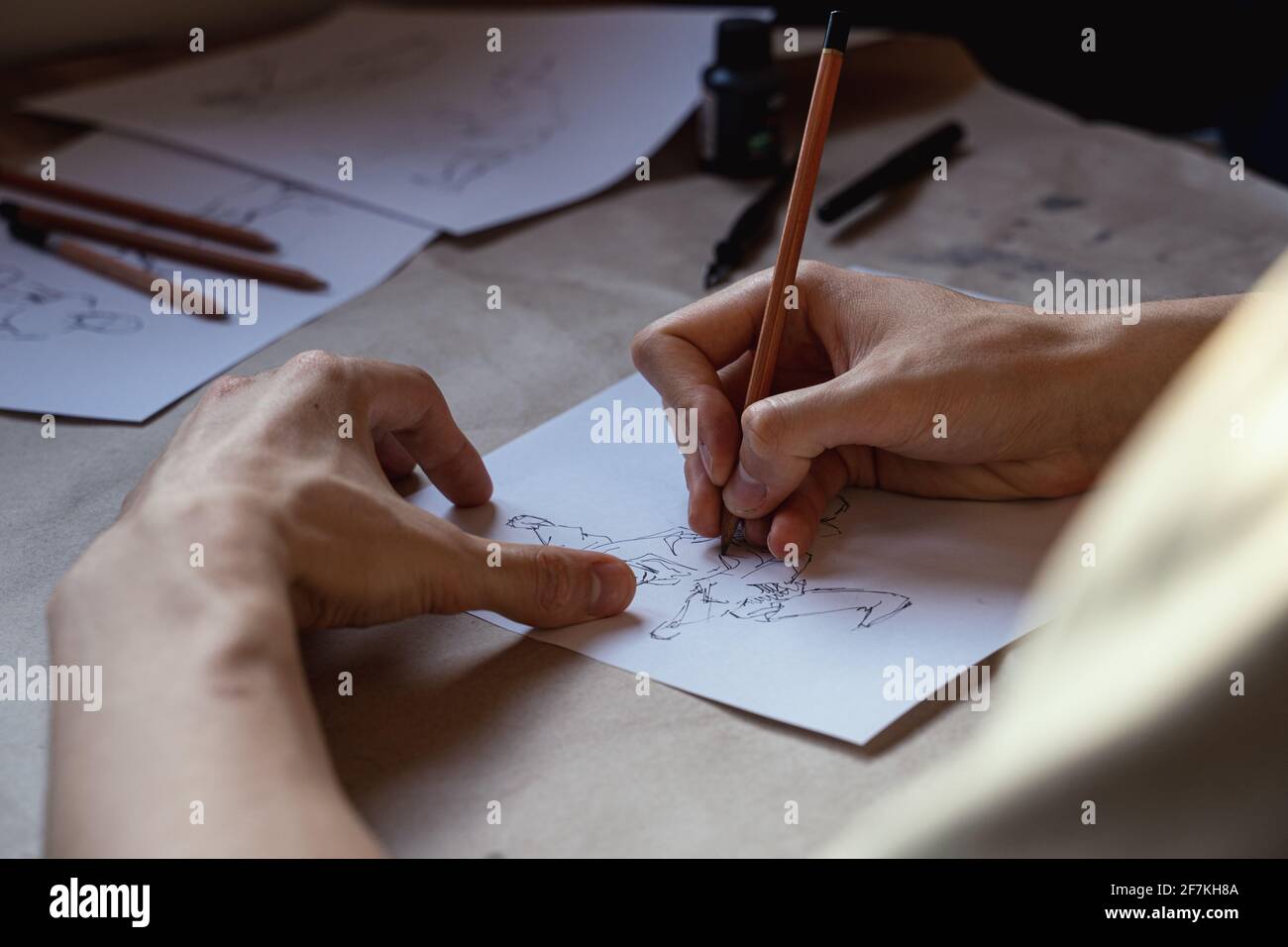 Artist drawing figure pencil sketches. Artwork background Stock Photo ...