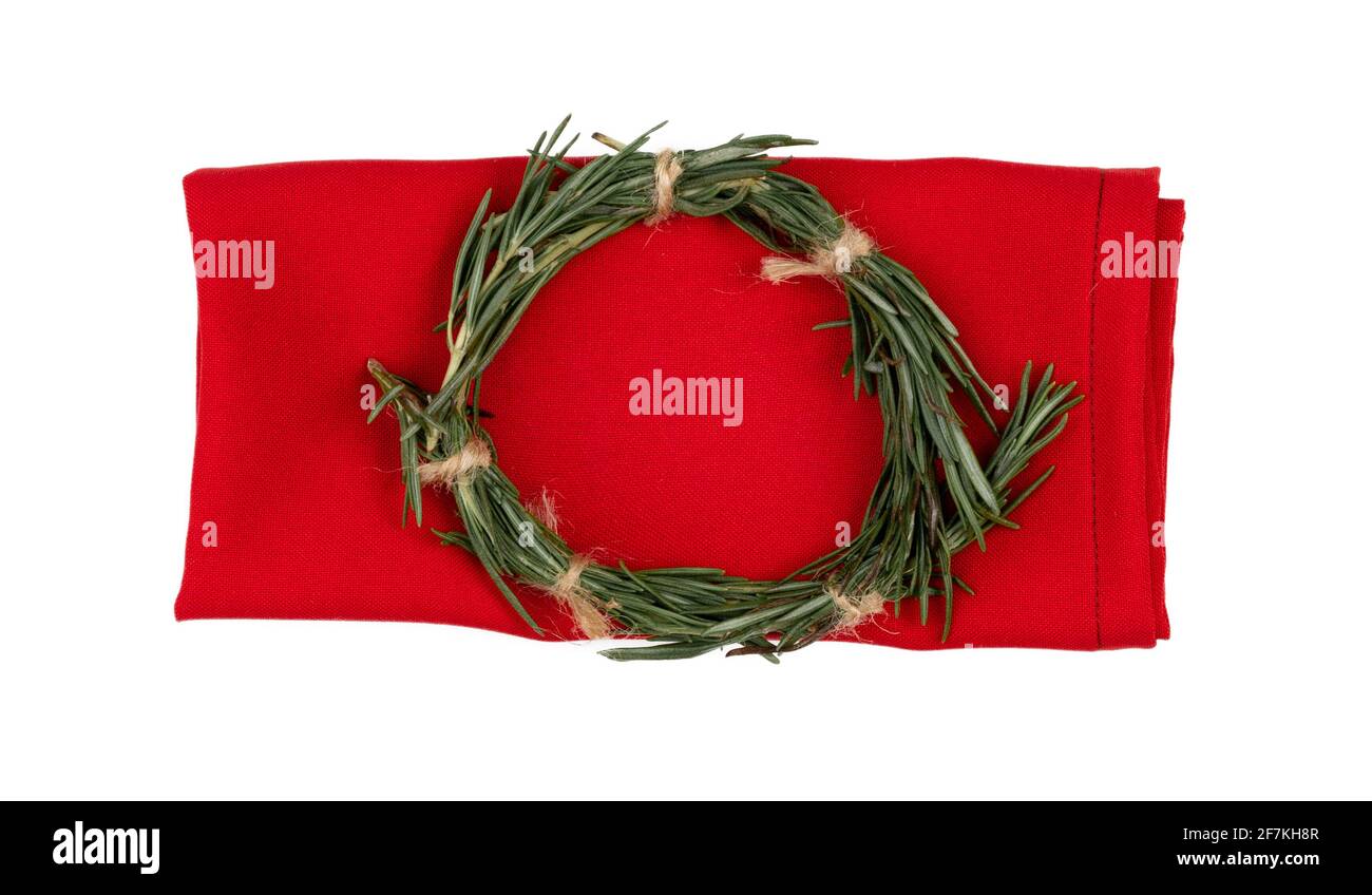 Red paper napkin and rosemary branch on white background Stock Photo ...