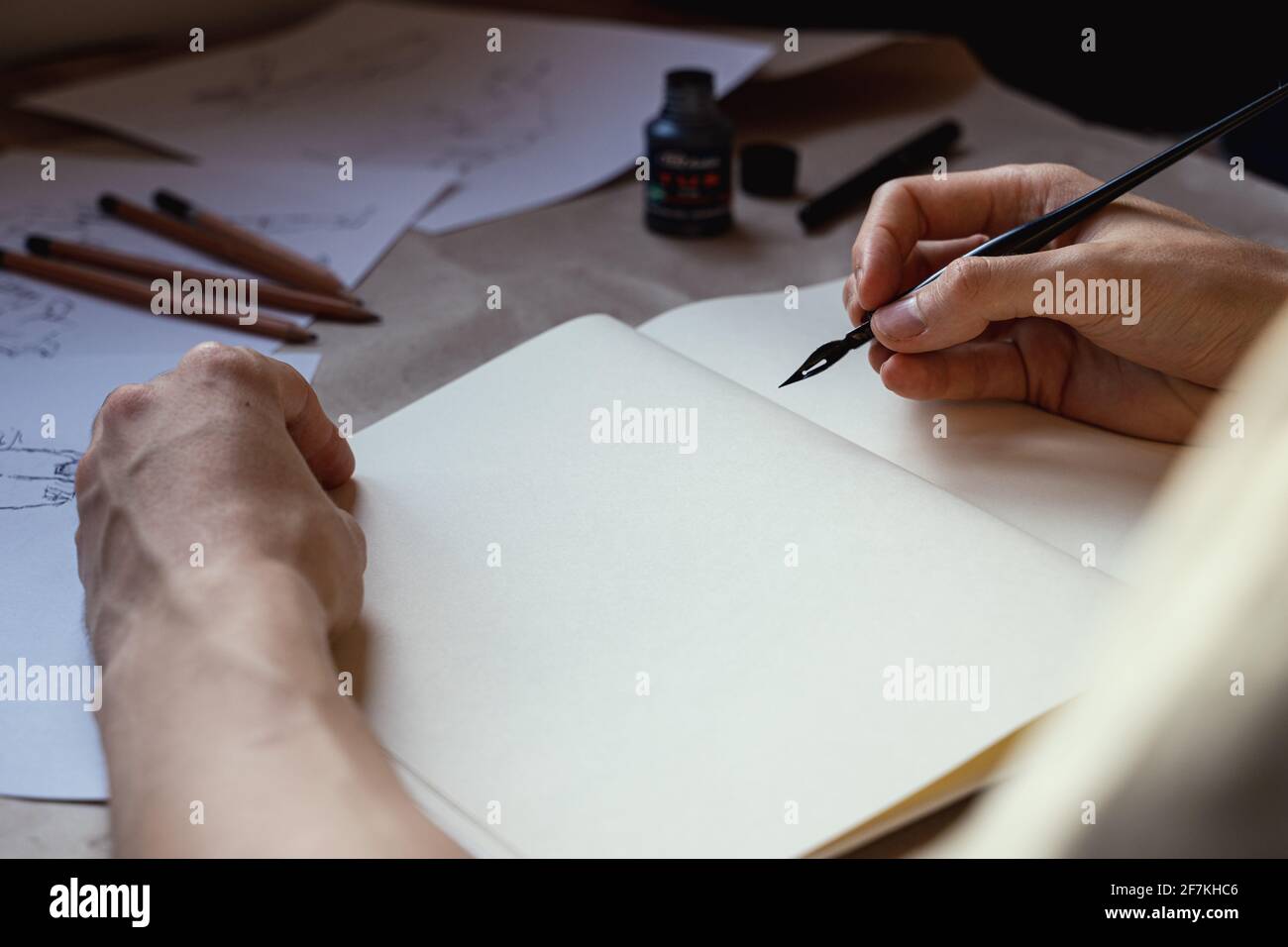 Artist drawing figure pencil sketches. Artwork background Stock Photo ...
