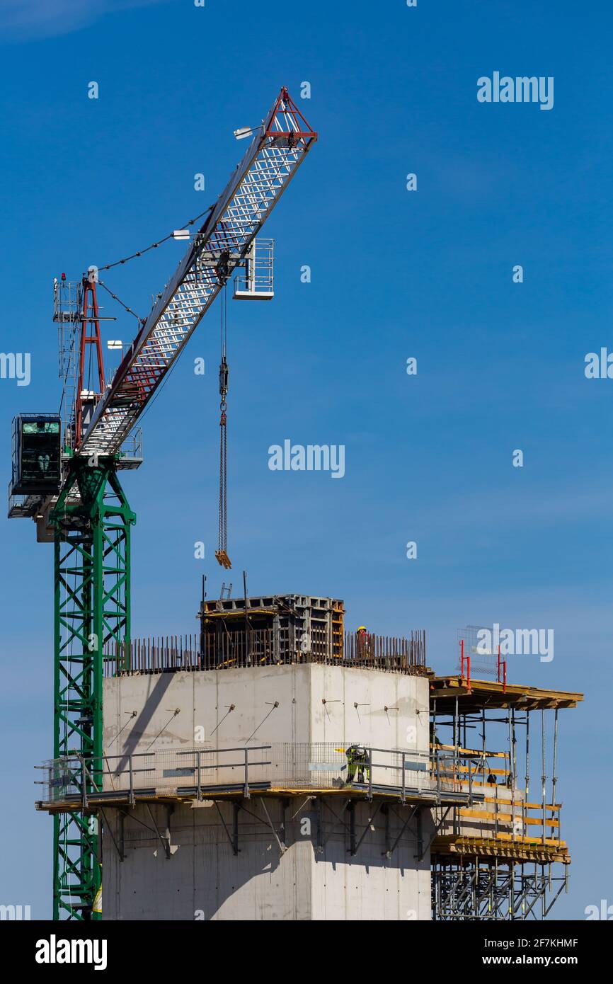Workers working at height on the construction of a public facility ...