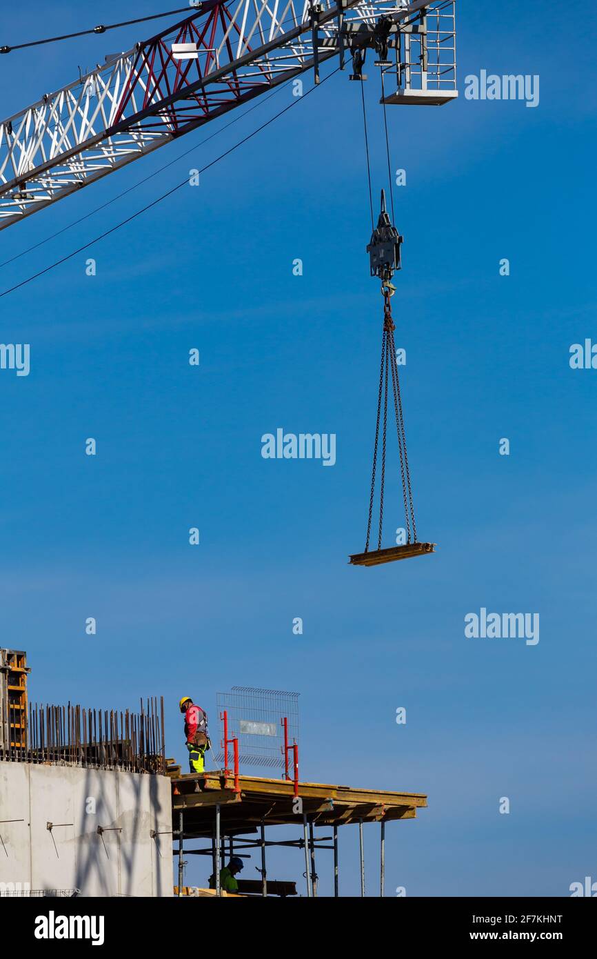 Workers working at height on the construction of a public facility ...